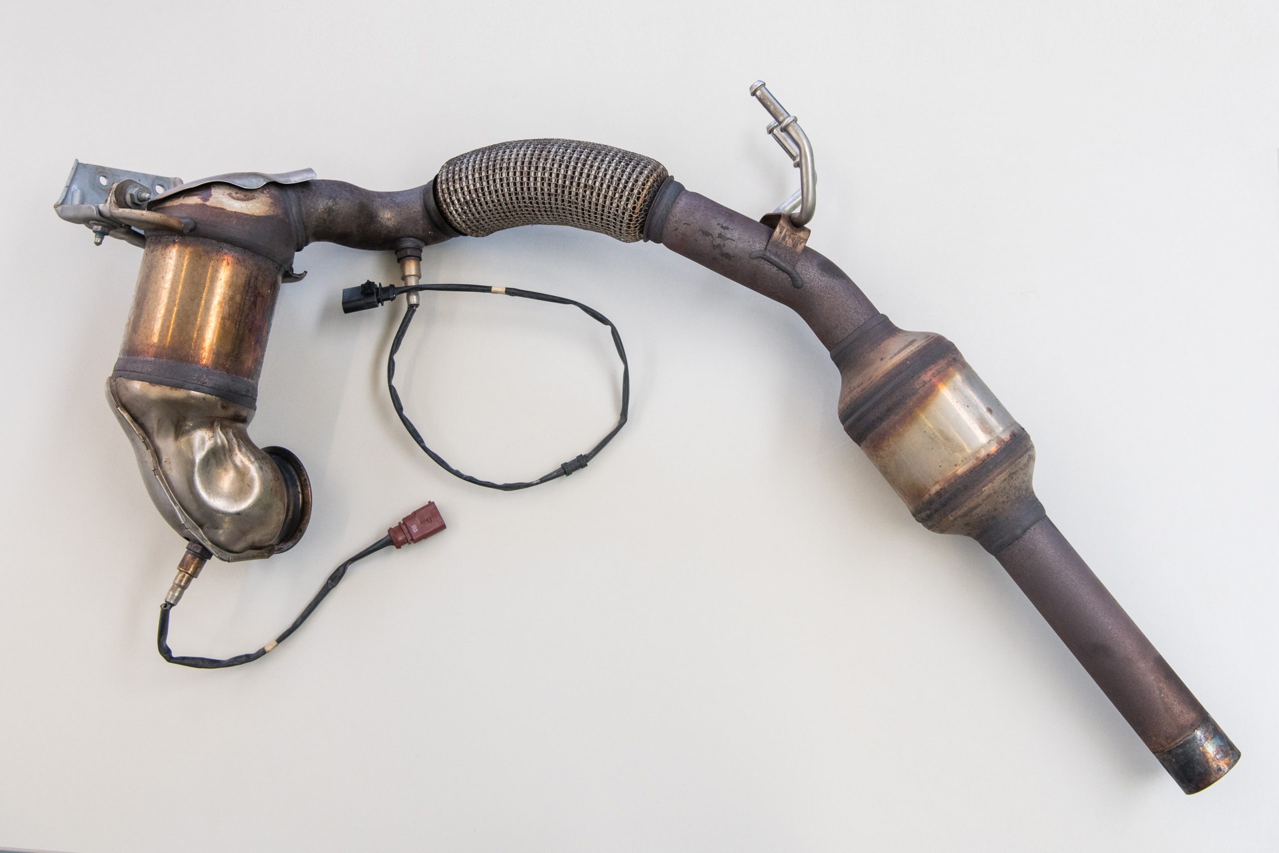 Front part of the exhaust pipe with compensator and catalytic converter ...